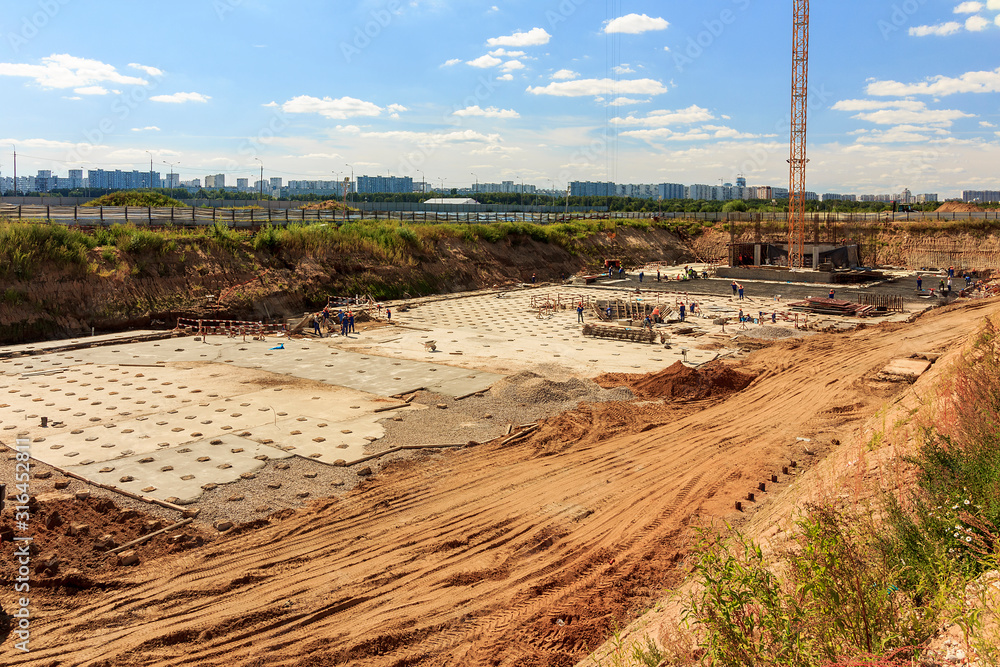 Pile driving in foundation pit for construction of apartment building ...
