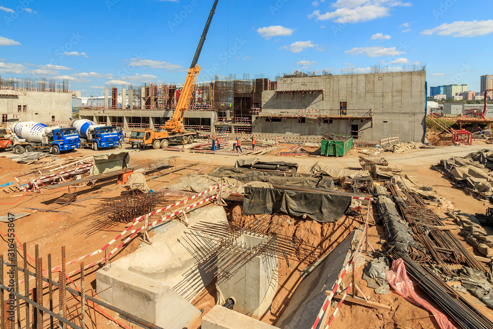 Pile driving in foundation pit for construction of apartment building ...