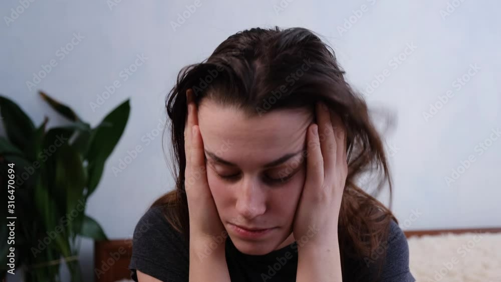 Vidéo Stock Desperate stressed miserable young woman hold head in hands ...