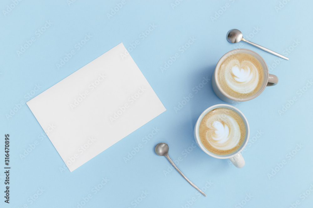 Foto de Coffee cup with latte art foam and empty sheet of paper for ...