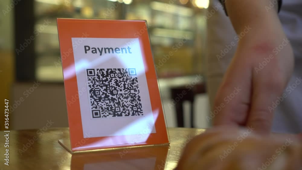 Qr code payment display in the cafe. To pay the product or a service ...