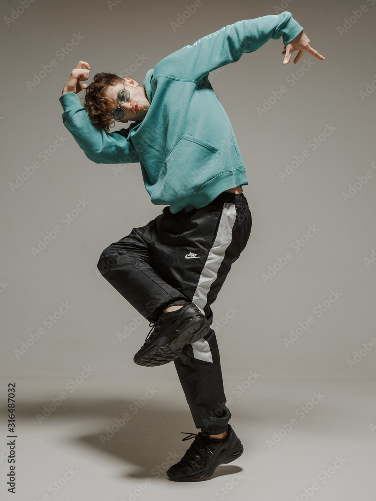 Boy dancing contemporary dance in studio. Acrobatic dancer. Stock Photo ...