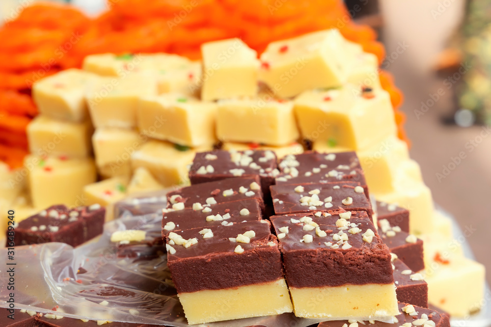 Traditional Indian sweets sold on street vending stalls Stock Photo ...
