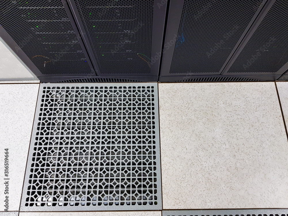 Raise floor and cool air ventilation panel in front of network rack ...