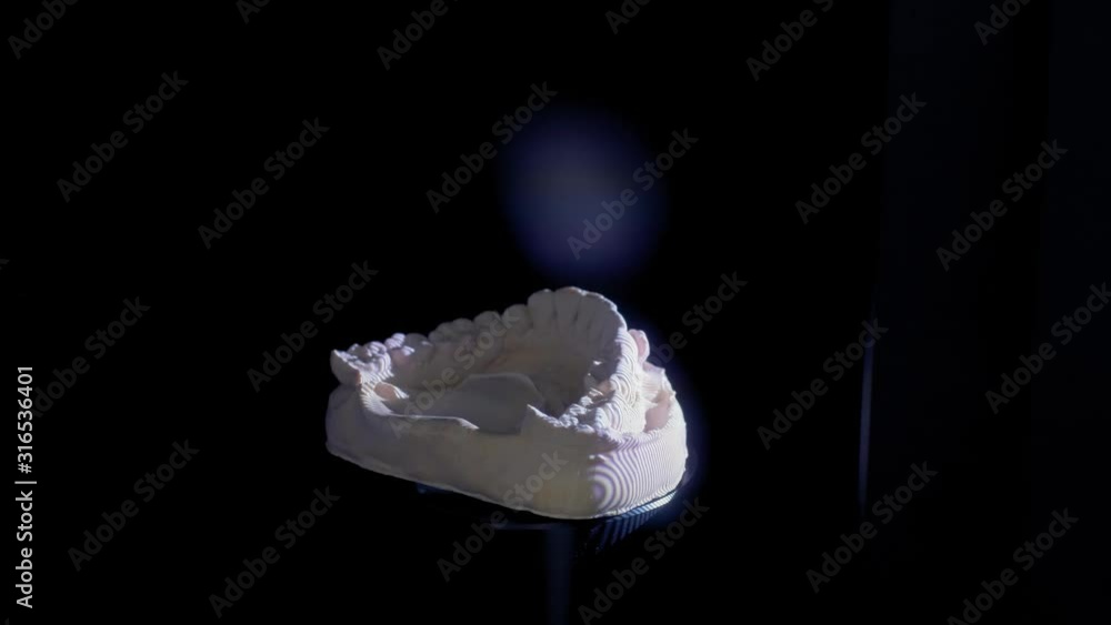 Dental prosthetic restoration. Denturist is making 3D model for ...