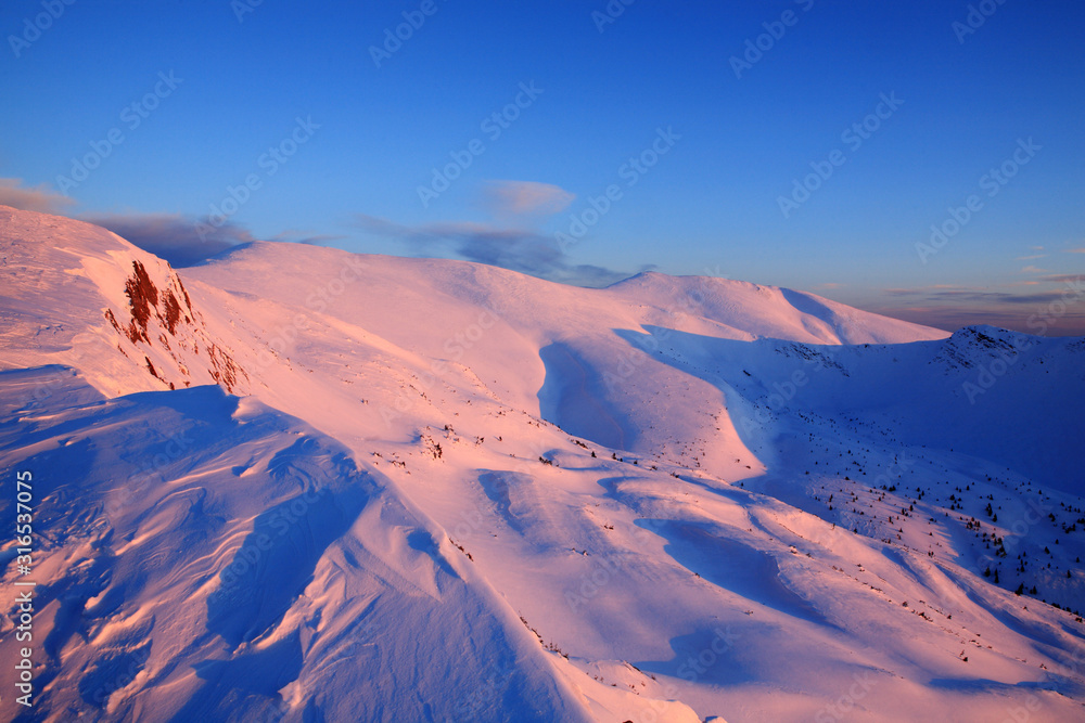 Sunset in winter mountains. Eastern Europe. Stock Photo | Adobe Stock