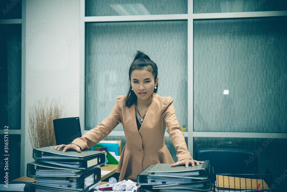 Asian woman working in office,young business woman stressed from work ...