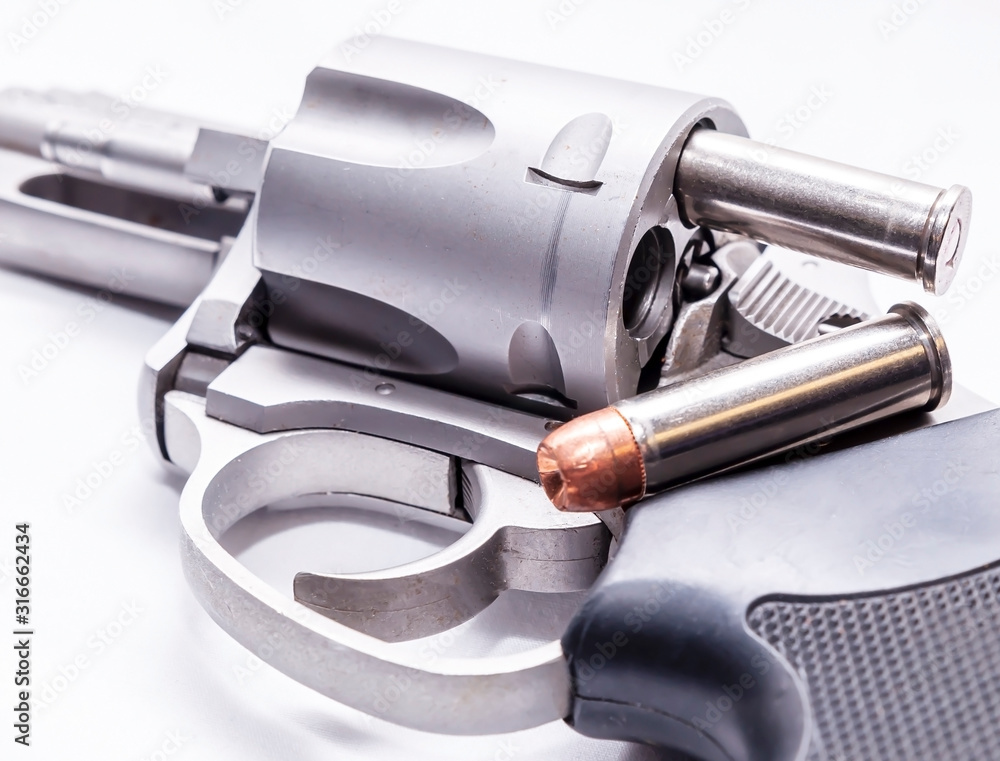 The opened cylinder of a stainless 357 magnum revolver with a hollow ...