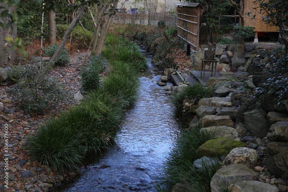 small Japanese clean canal with livable environment. peaceful scene of ...
