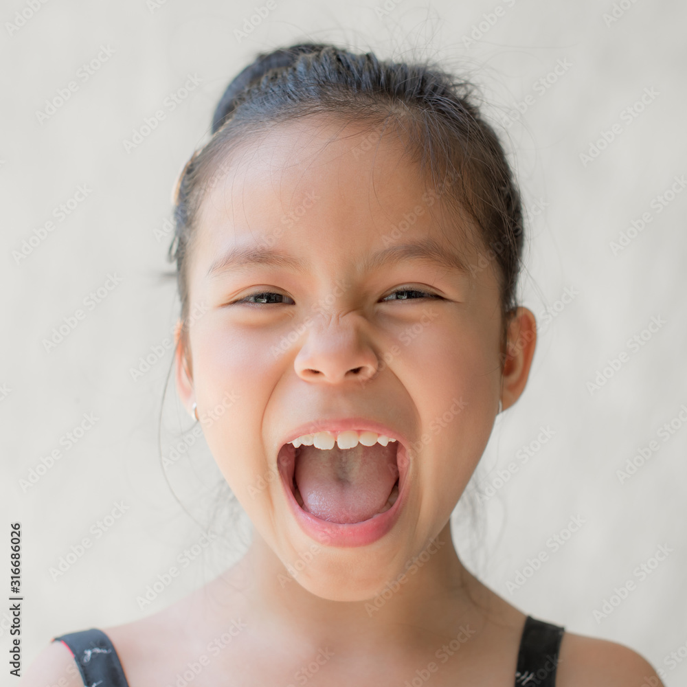 portrait of a happy smiling beautiful and confident child girl ...