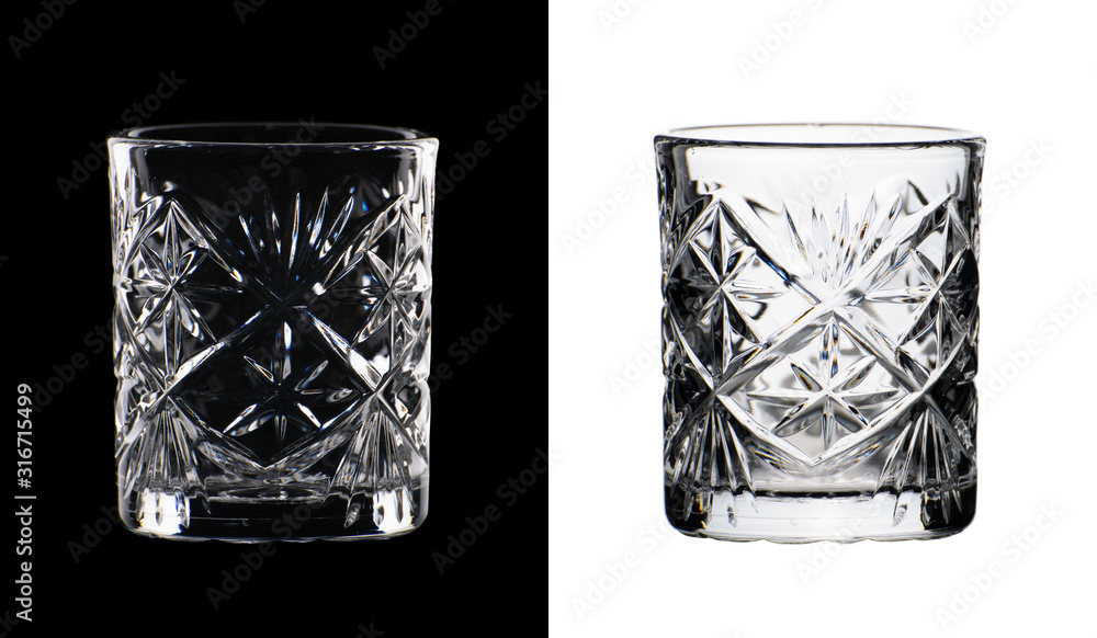 Crystal glass with embossed pattern in two versions isolated on black ...
