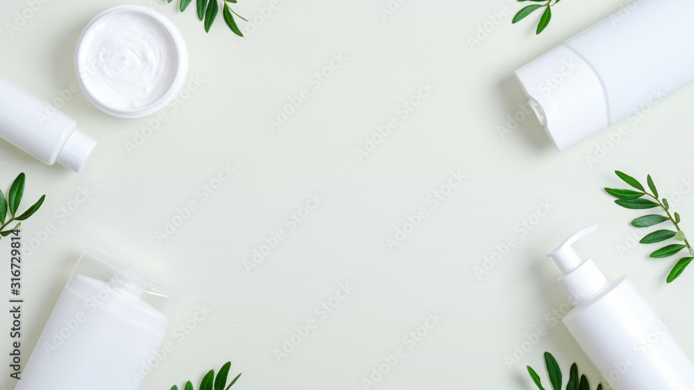 Frame of natural cosmetic products and green leaves. Top view hand ...