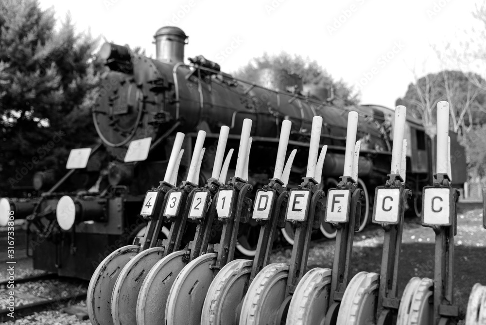 Old steam train, locomotive. Old railway switches with manual control ...