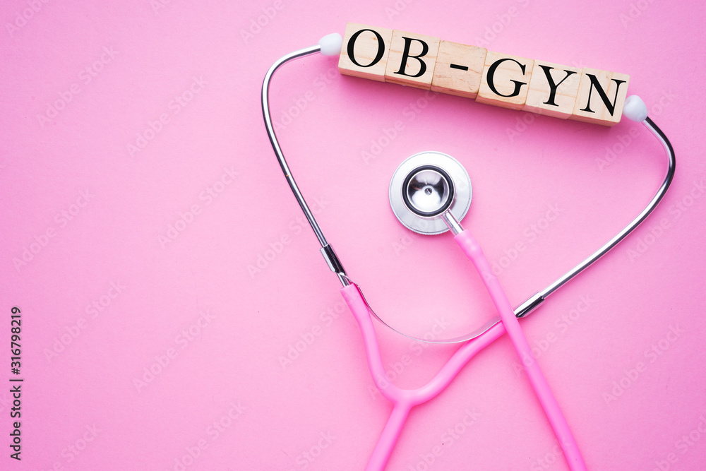 Women in healthcare concept. A pink strethoscope on a pink background ...