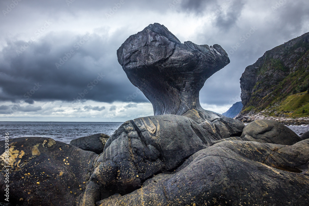 Kannesteinen rock formed by erosion on the sea coast of Norway Stock ...