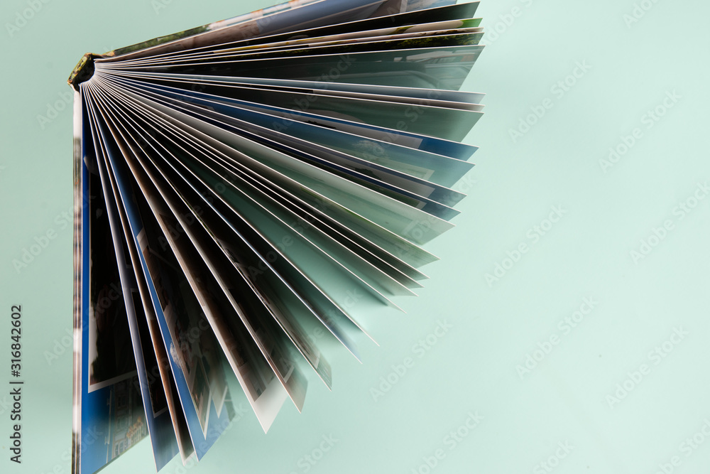 open photobook on a light background, open book Stock Photo | Adobe Stock