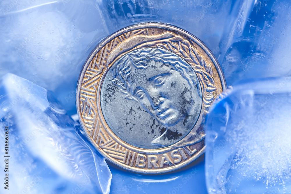 Brazilian coin, Real. Illustration of the devaluation of the Brazilian ...