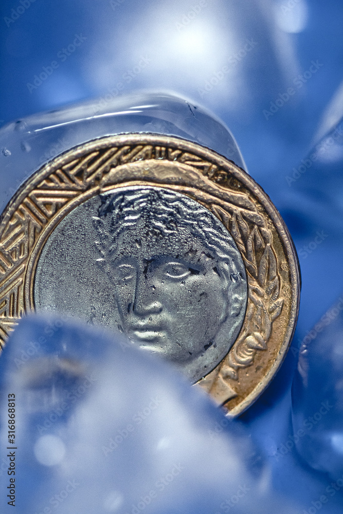 Brazilian coin, Real. Illustration of the devaluation of the Brazilian ...