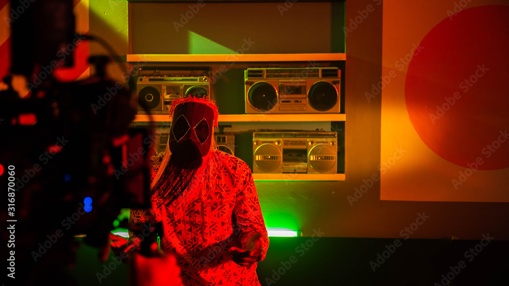 Rapper with African Mask On Stock Photo | Adobe Stock