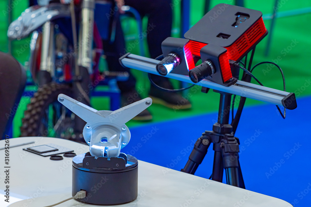 3D scanner. Device scans a metal part. Equipment for creating three ...