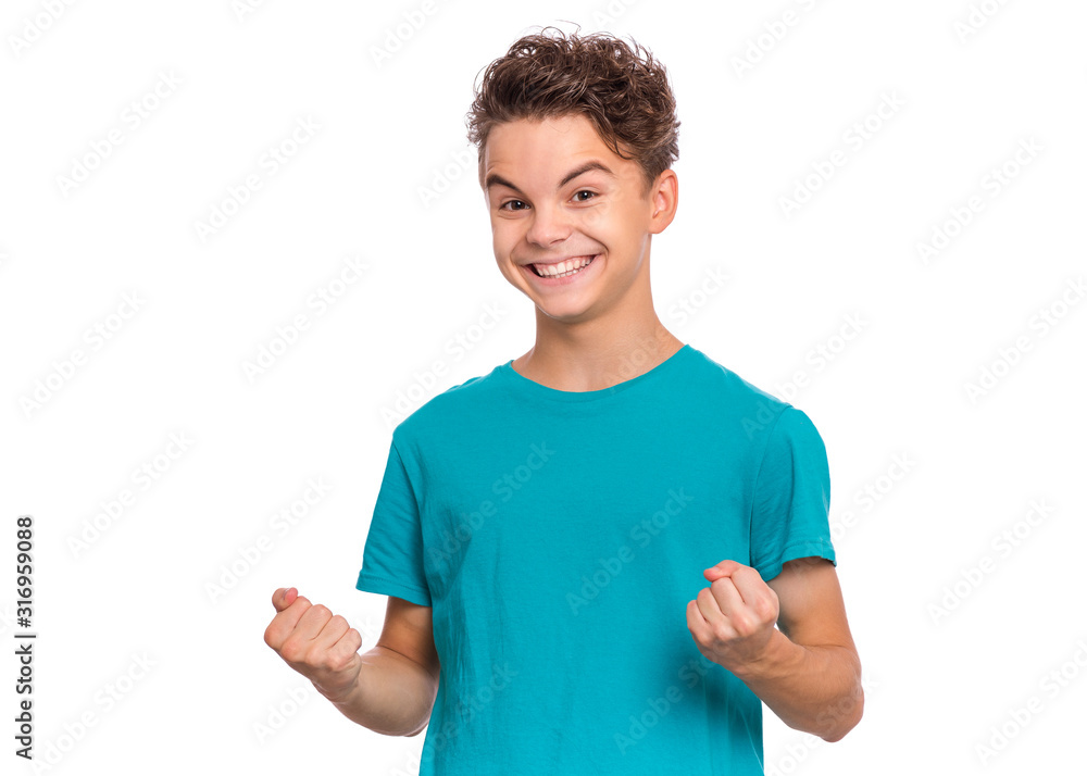 Portrait of successful teen boy with winner gesture, clenching fists ...