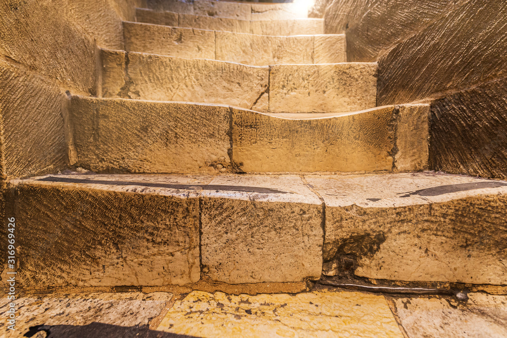 Heavily worn steps of a stairs in Church o a Holy Sepulchre, Jerusalem ...