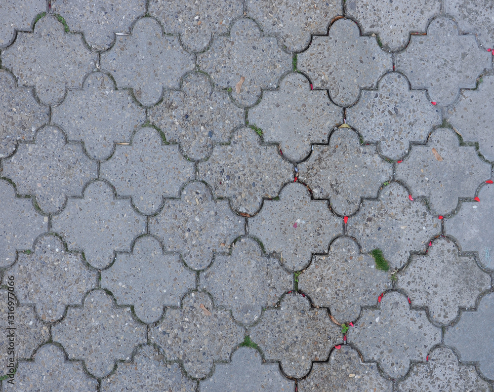 Gray road tiles of city street pavement. Cobblestone pathway paved with ...
