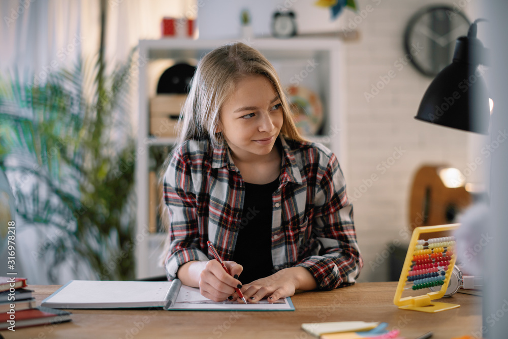 Beautiful girl learning at home. Schoolgirl doing homework. Stock Photo ...