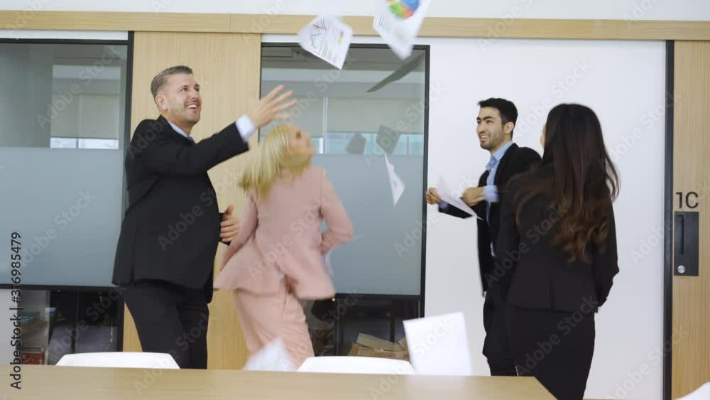 Vidéo Stock Group of multiethnic business people celebrating their ...