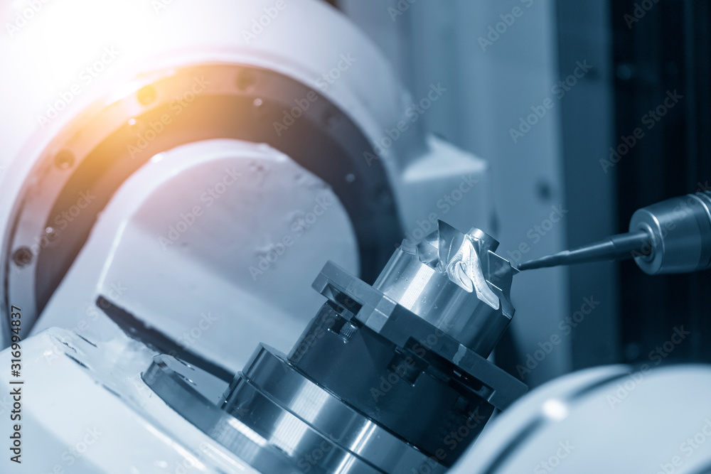 The 5-axis CNC milling machine cutting the sample of aluminium turbine ...