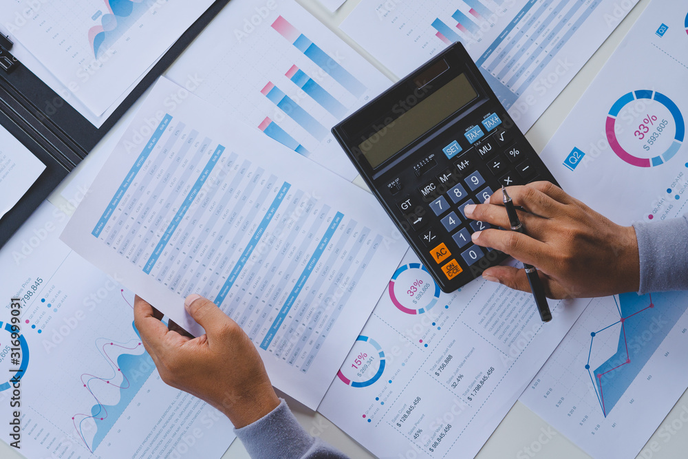 businessman working calculate data document graph chart report ...