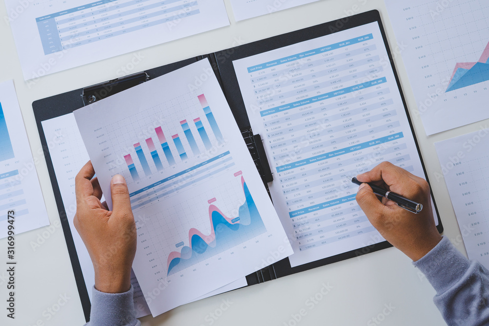 businessman working calculate data document graph chart report ...