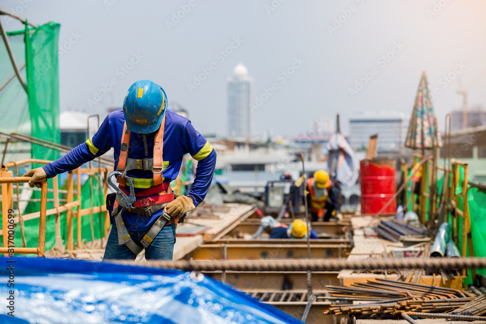 Builder worker in safety protective equipment. Professional industrial ...
