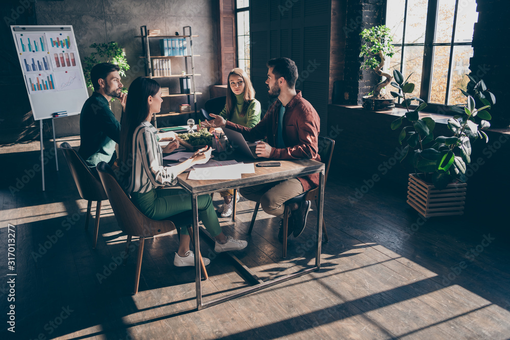 Full length photo of group people sit desk table have briefing ...