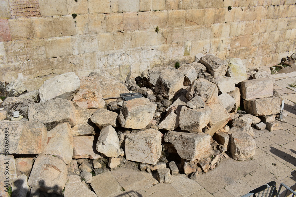 Fallen stone blocks from a section of the wall surrounding the Temple ...