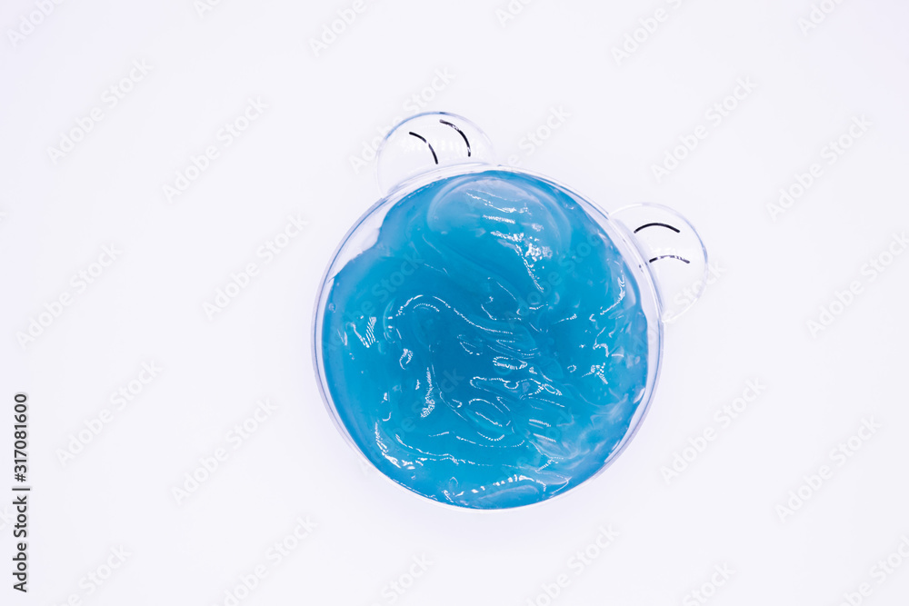 Close up of a transparent plastic container in the shape ob bear head ...