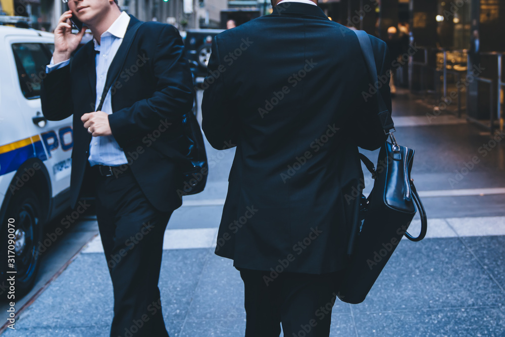 Employees walking along street in opposite directions Stock Photo ...