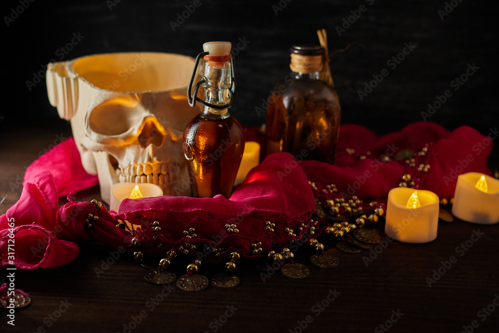 Hand using mortar Scary still life with potions, skull, mortar, vintage ...