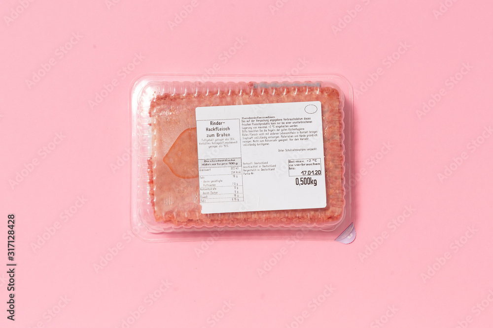 Black plastic pack with fresh hash isolated on pink background. Raw ...