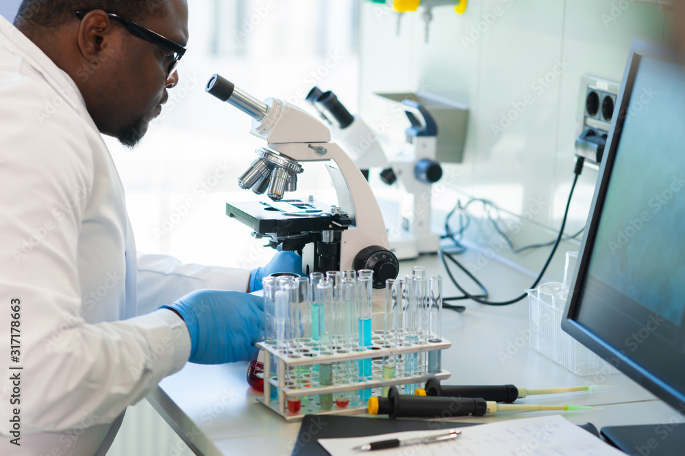 African-american scientist working in lab. Doctor making microbiology ...