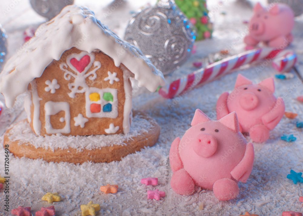 Gingerbread house and three little pigs. Stock Photo | Adobe Stock
