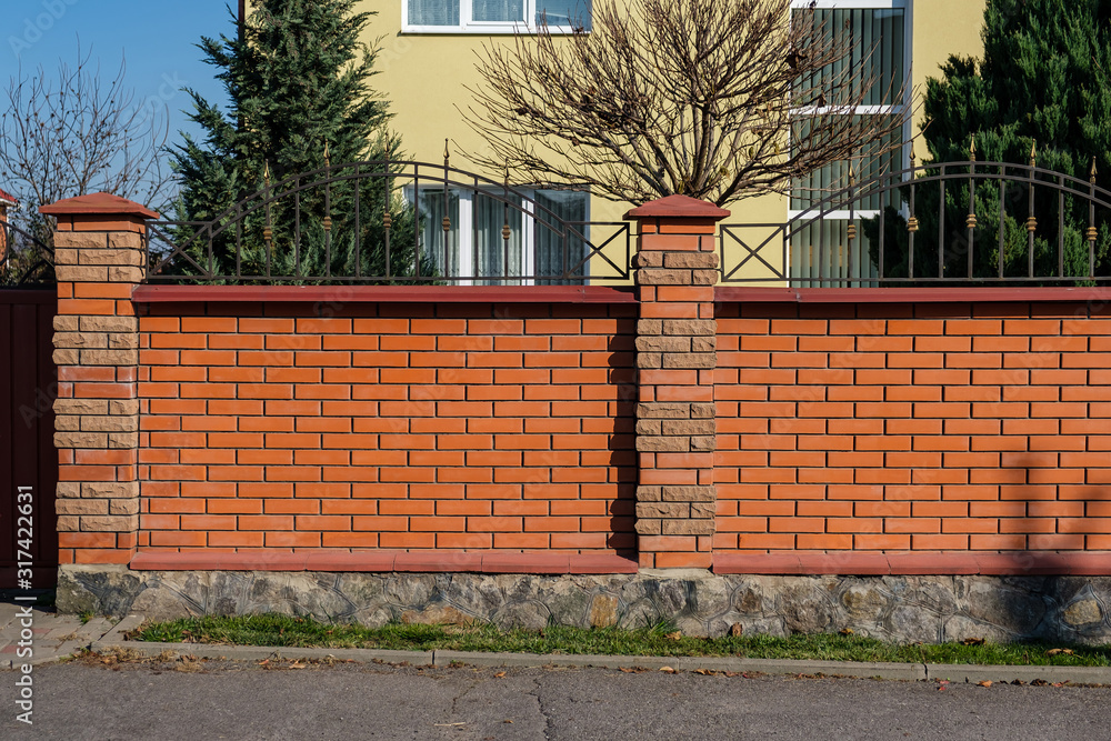 Decorative modern red brick fence with brick columns. Stock Photo ...
