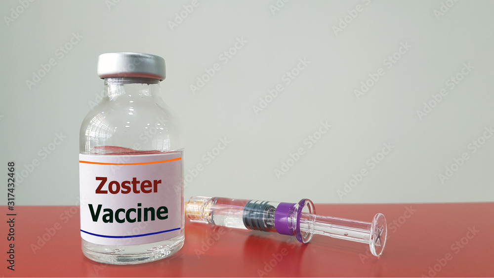 Bottle of Zoster vaccine and syringe for injection. Vaccine use for ...