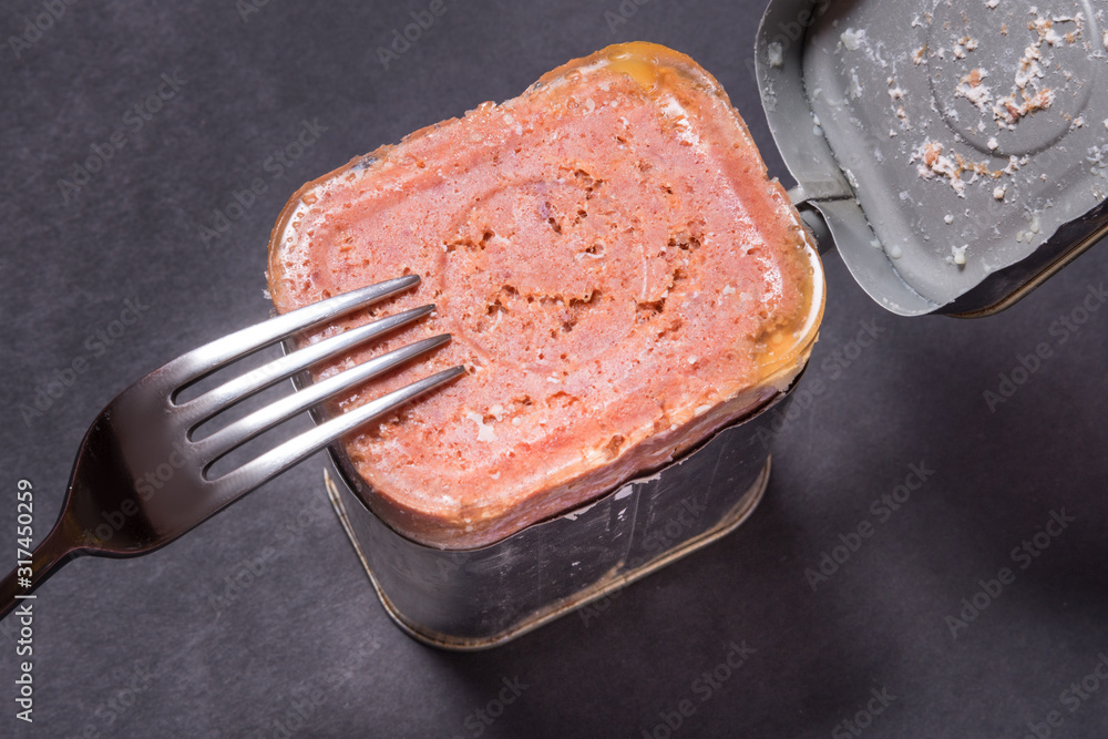Opened tin can with corned beef, top view yellow background Stock Photo ...