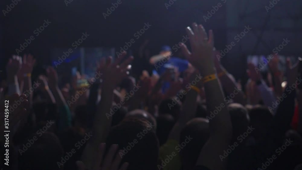 Indoor music festival. Crowd enjoy rap concert, dancing in nightclub ...