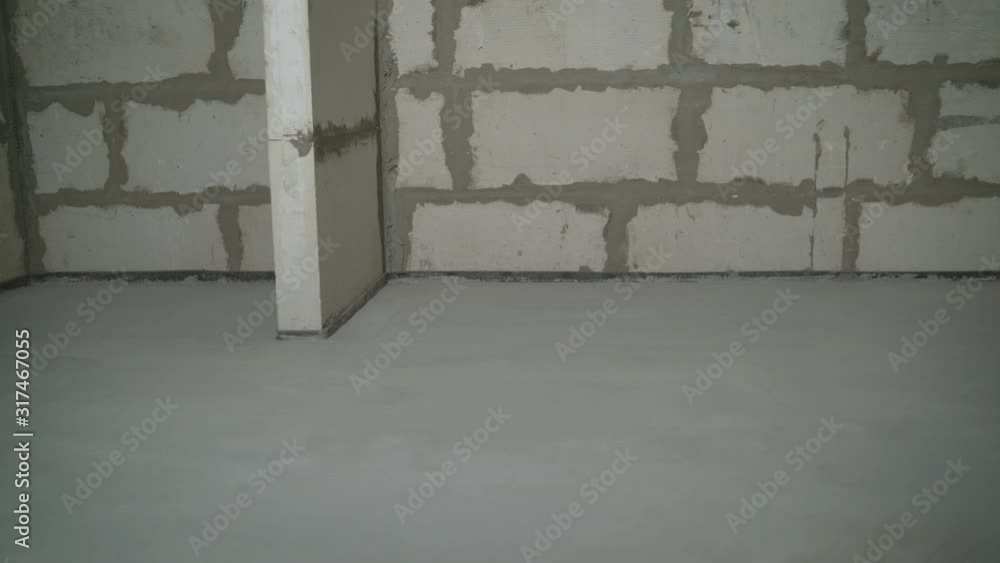 Builders leveled the floor with a mortar and a mixture. Fill screed ...