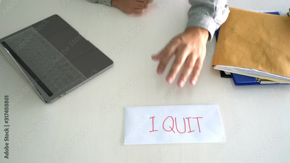 4k video of Business man signing his resignation in office write I Quit ...
