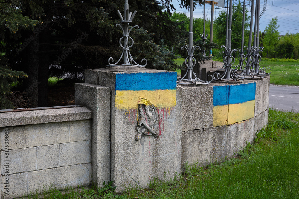 Soviet symbols of communism and the Ukrainian flag. Decommunization ...