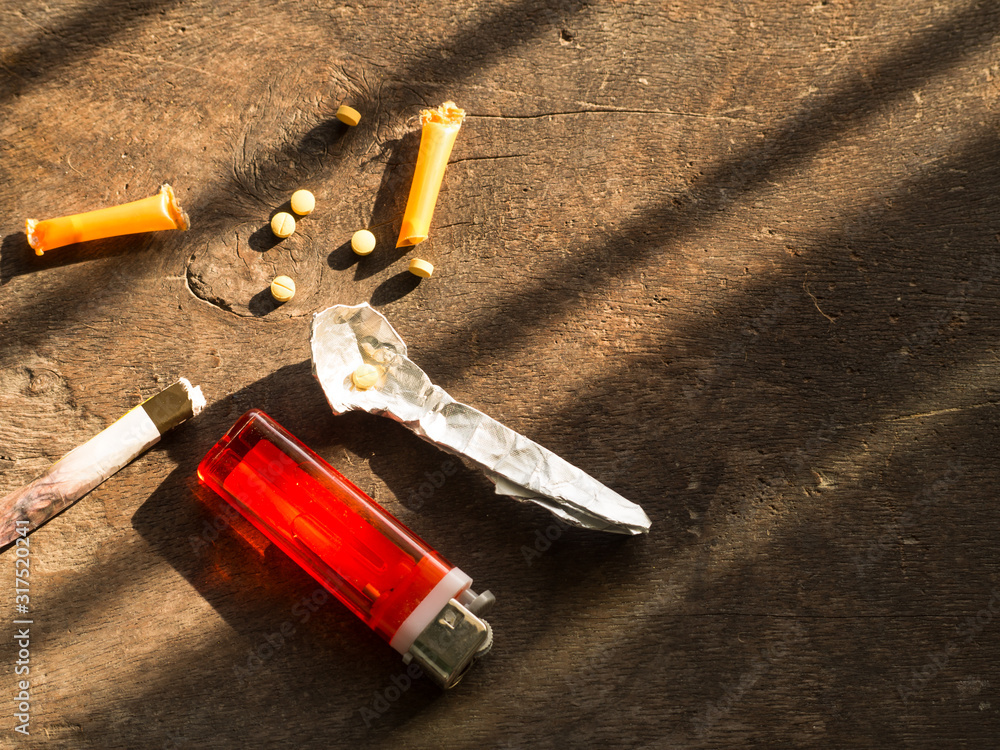 Narcotic Recreational drugs concept. amphetamine,orange straw,cigarette ...