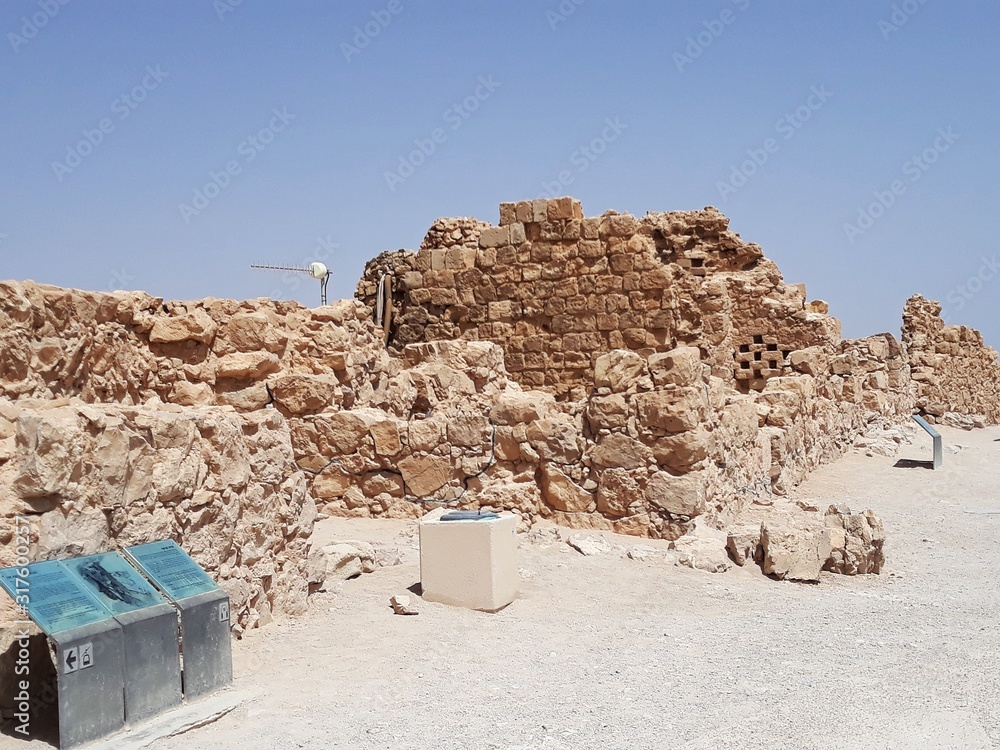 Ruins of the ancient Masada, a mountaintop fortress, near the Dead Sea ...